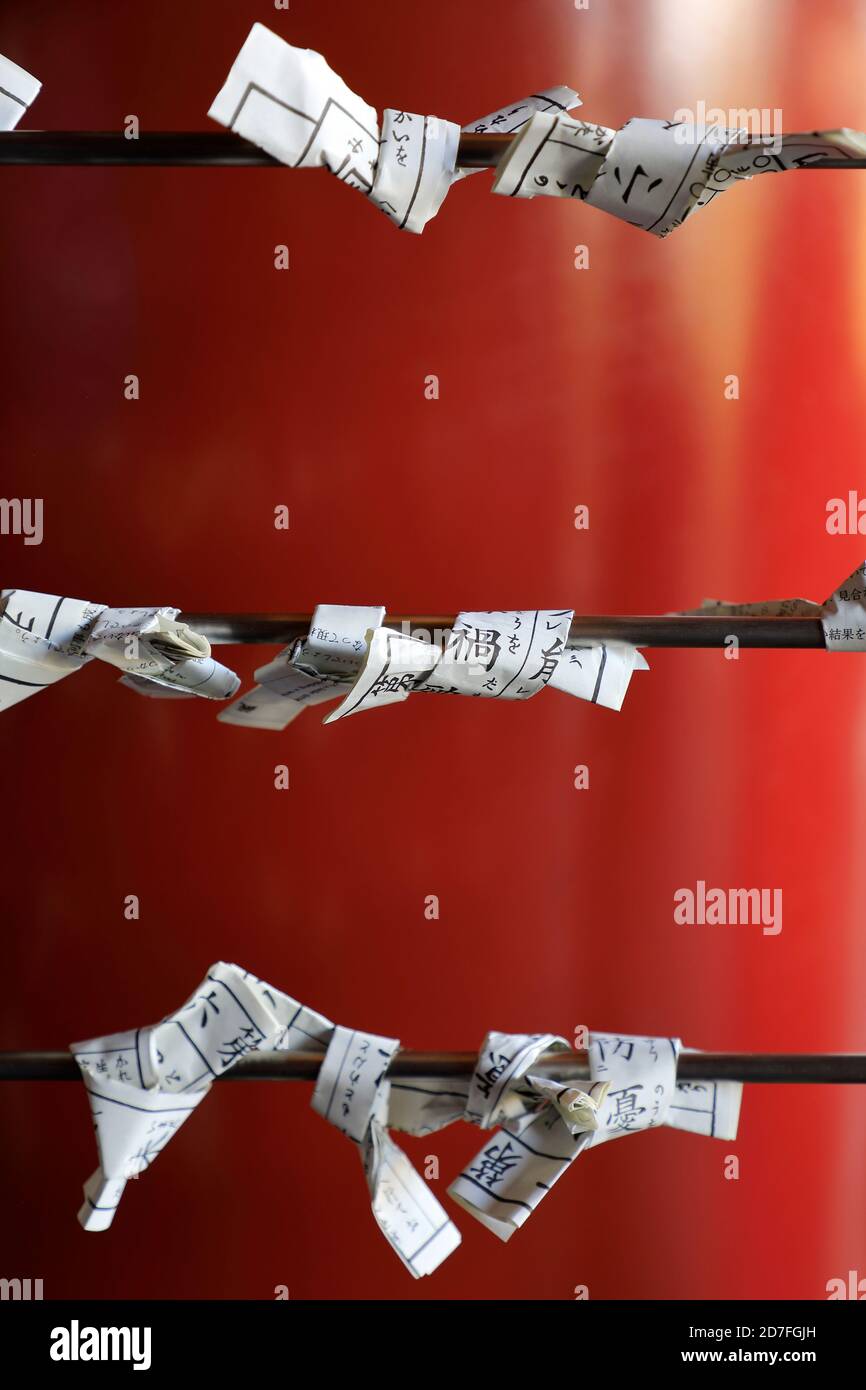 Visitors tied their bad fortune notes on ropes outside the main hall of ...