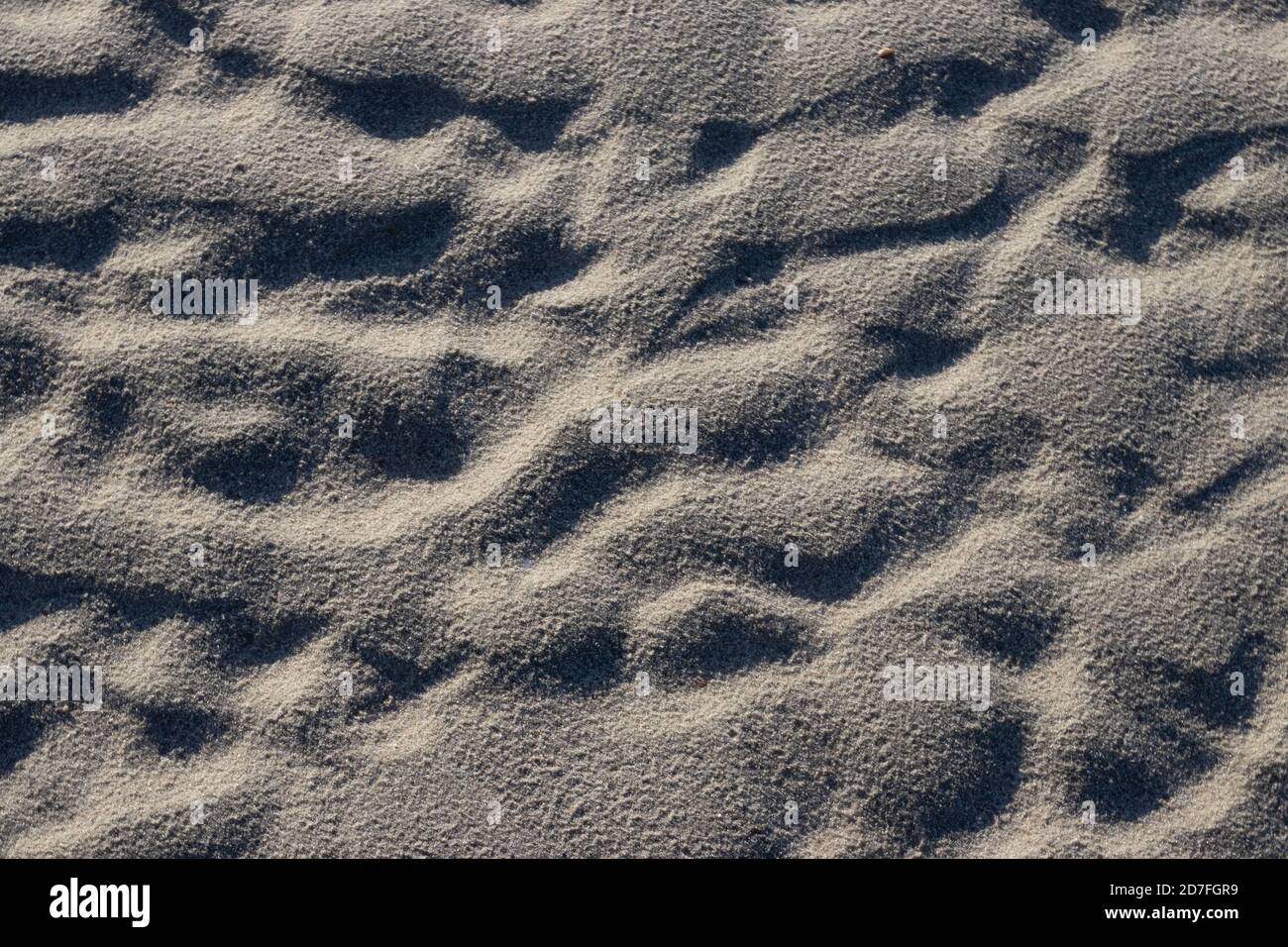 Textures and shapes made by water and wind on the sand, at the beach ...