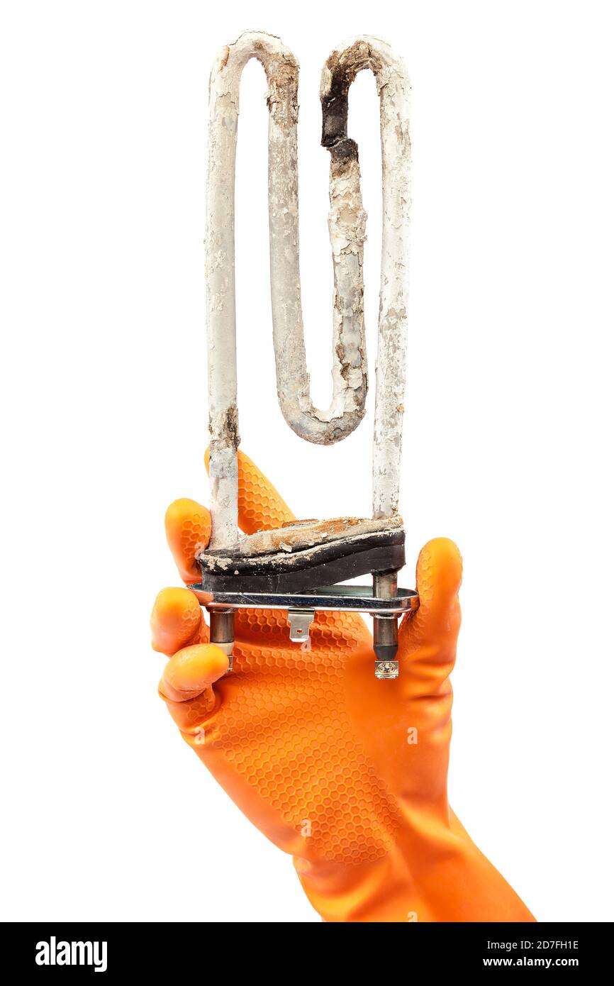 Damaged heating element of the washing machine in hand isolated on ...