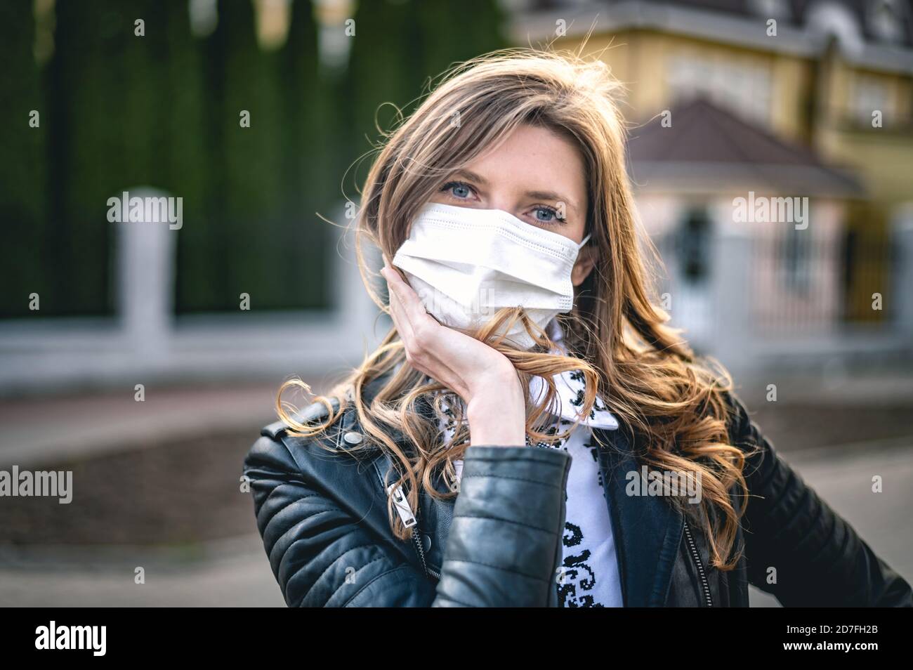 Portrait of a young woman in a mask. Second wave of coronavirus ...