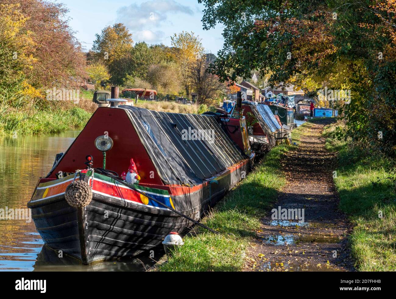 narrow boats and barges moored on the towpath of the grand union canal at braunston ...