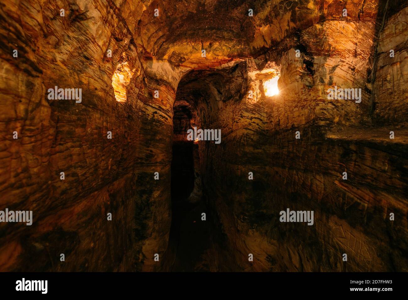 Ancient narrow underground passage in sandstone at old underground ...