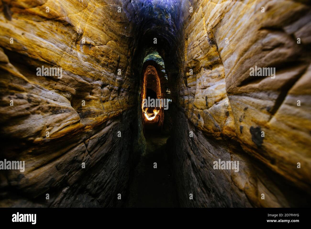 Ancient narrow underground passage in sandstone at old underground ...