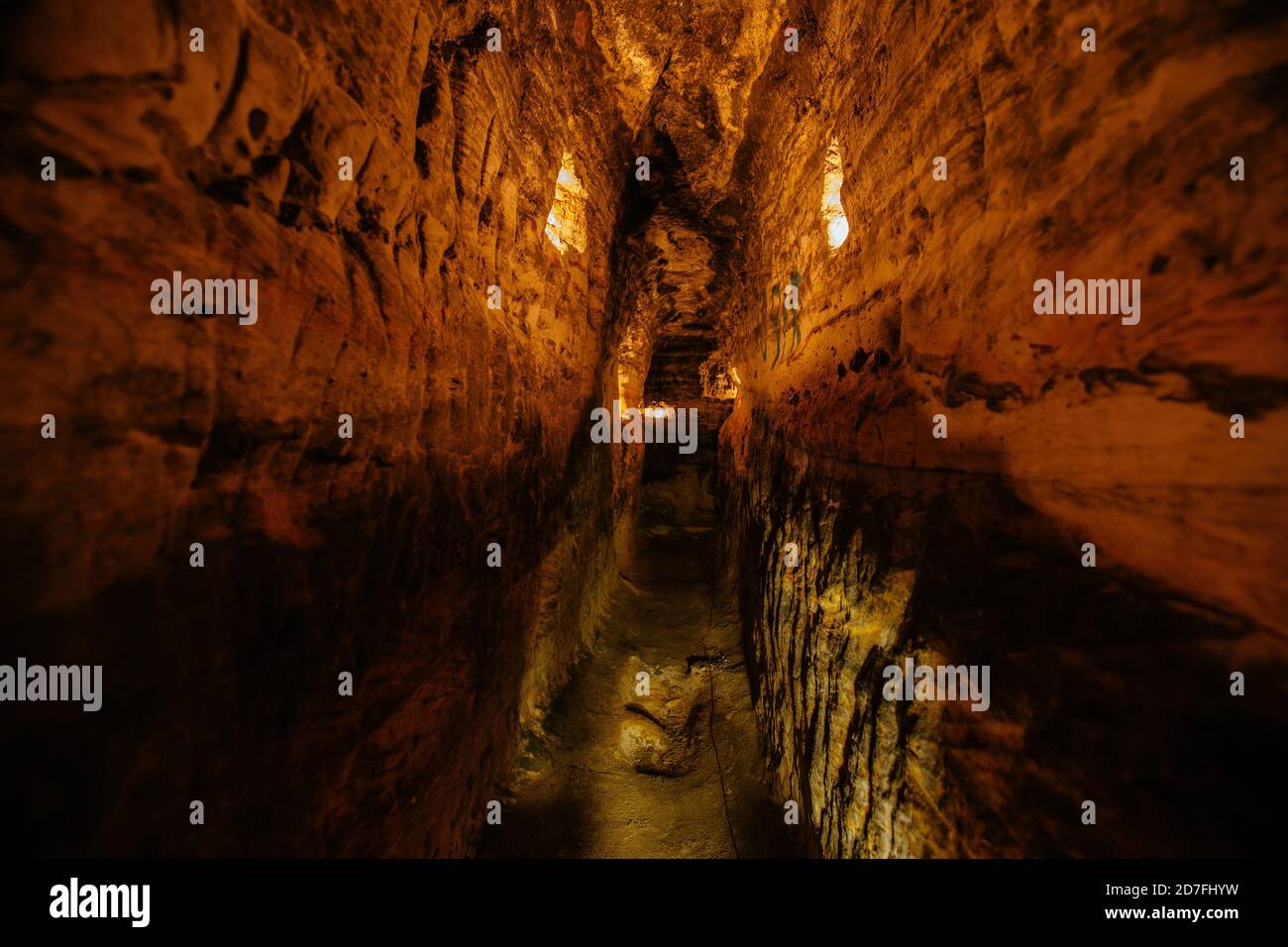 Ancient narrow underground passage in sandstone at old underground ...