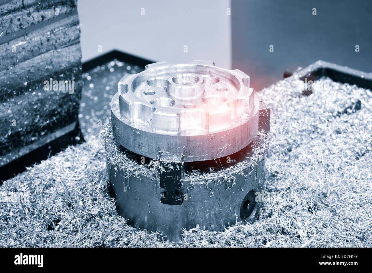 The Hi-precision CNC milling machine with cutting sample in blue-silver ...