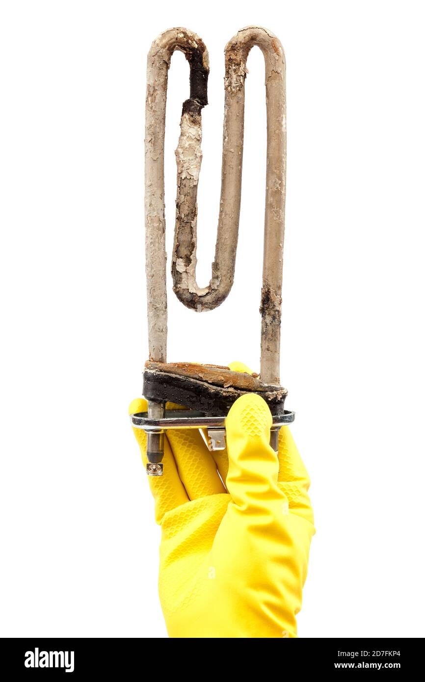Damaged heating element of the washing machine in hand isolated on ...