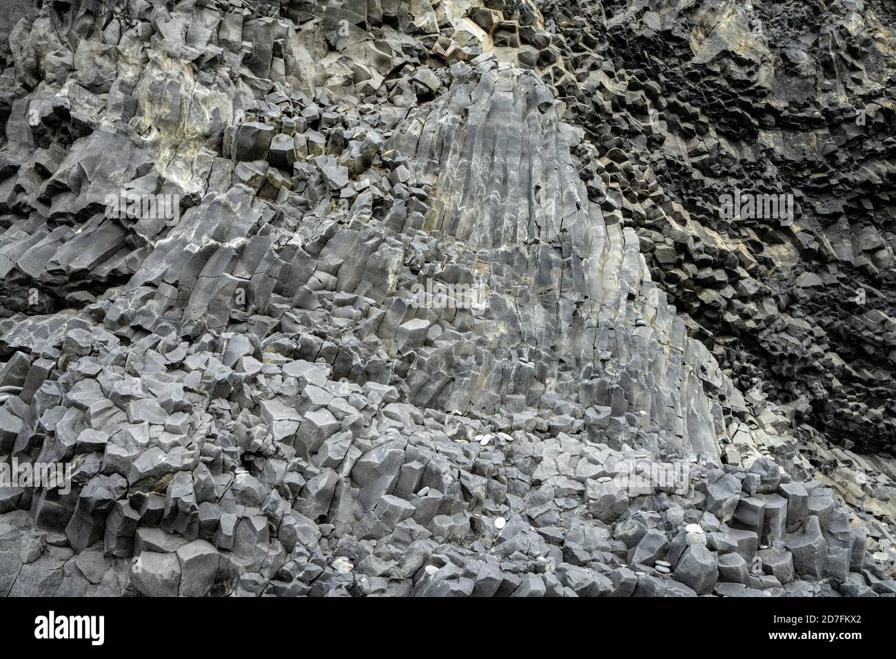 Backdrop from basalt volcanic rock formations in Reinisfjara beach near ...