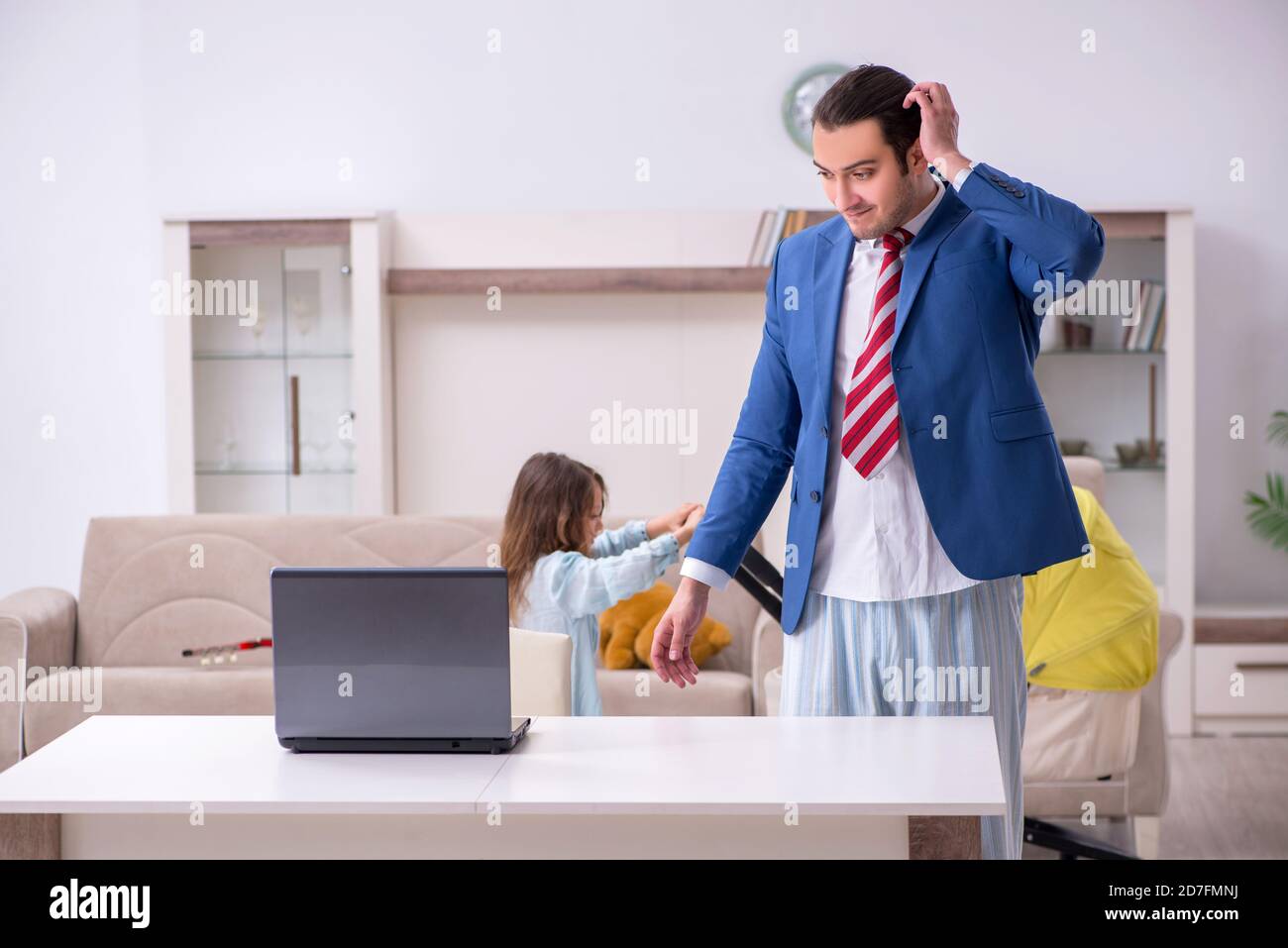 Young father of two children working from house Stock Photo - Alamy