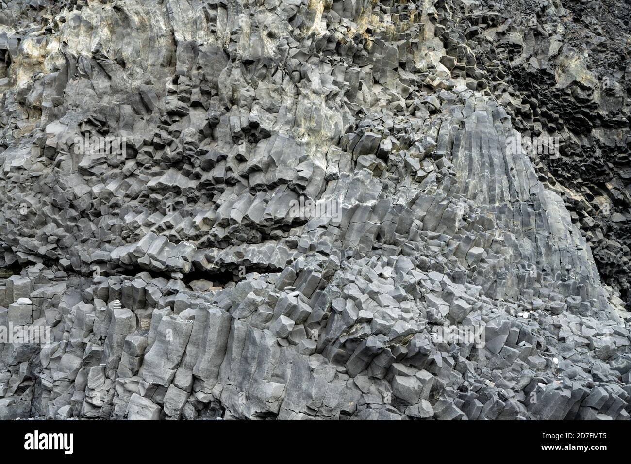 Backdrop from basalt volcanic rock formations in Reinisfjara beach near ...