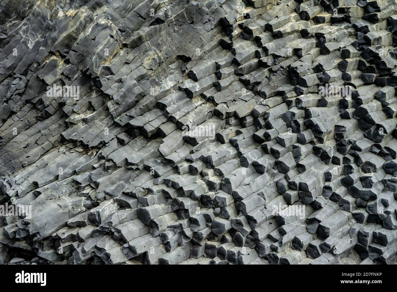 Backdrop from basalt volcanic rock formations in Reinisfjara beach near ...