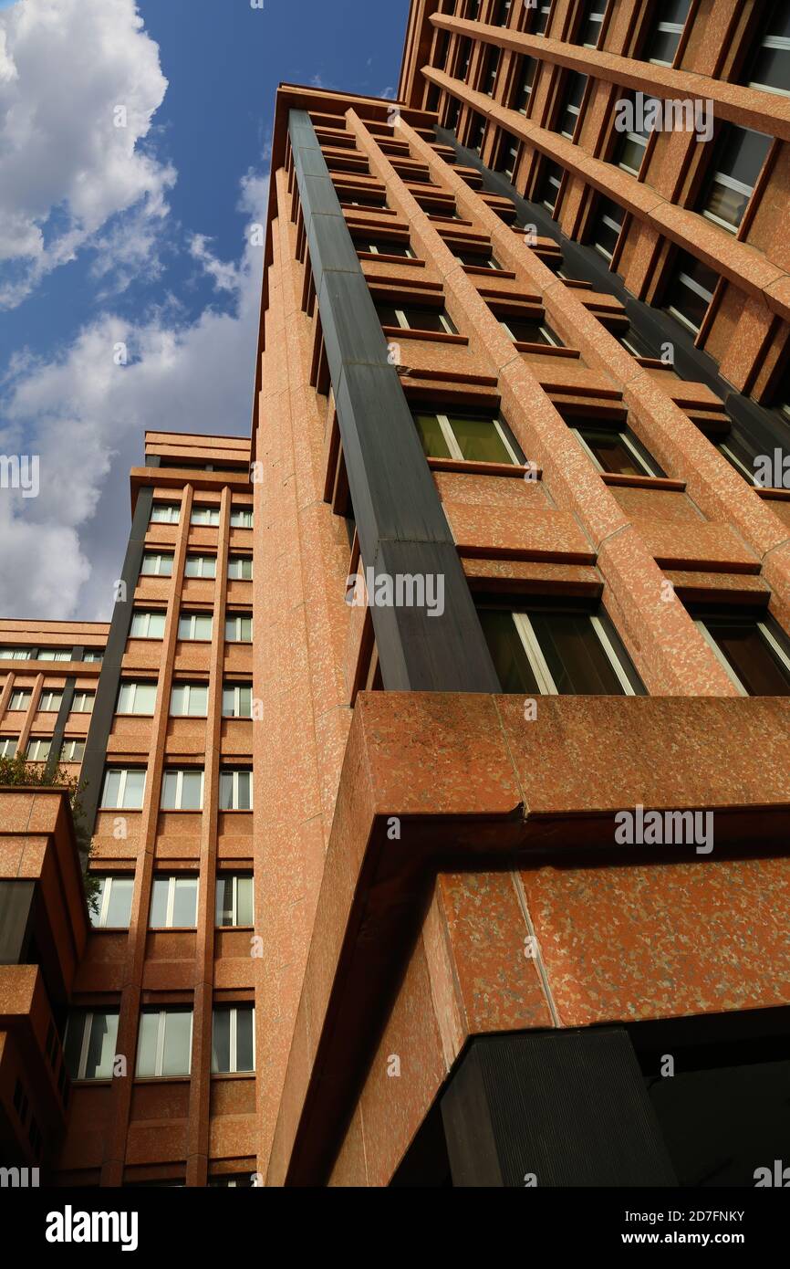 Looking up at the modern facade of corporate building in Genoa Madre di ...