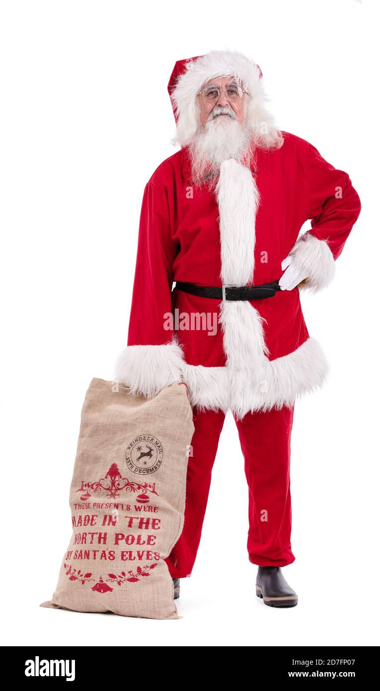 Santa Claus with a gift bag cut out on a white background Stock Photo ...
