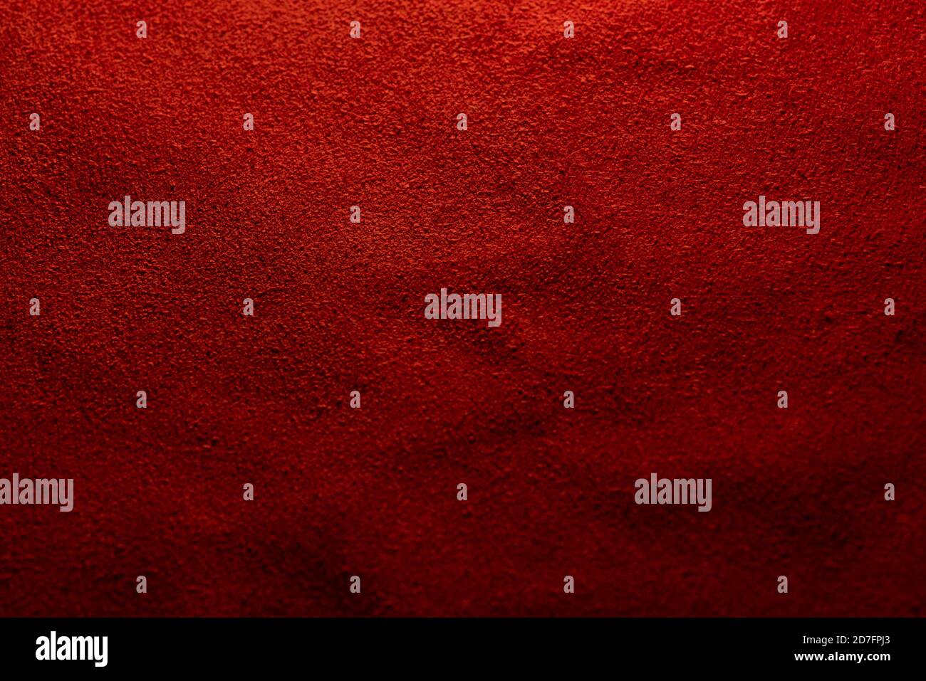 Red matte background of suede fabric, closeup. Velvet texture of ...