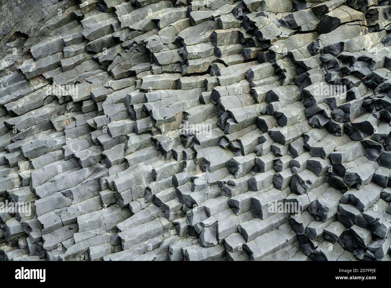Backdrop from basalt volcanic rock formations in Reinisfjara beach near ...