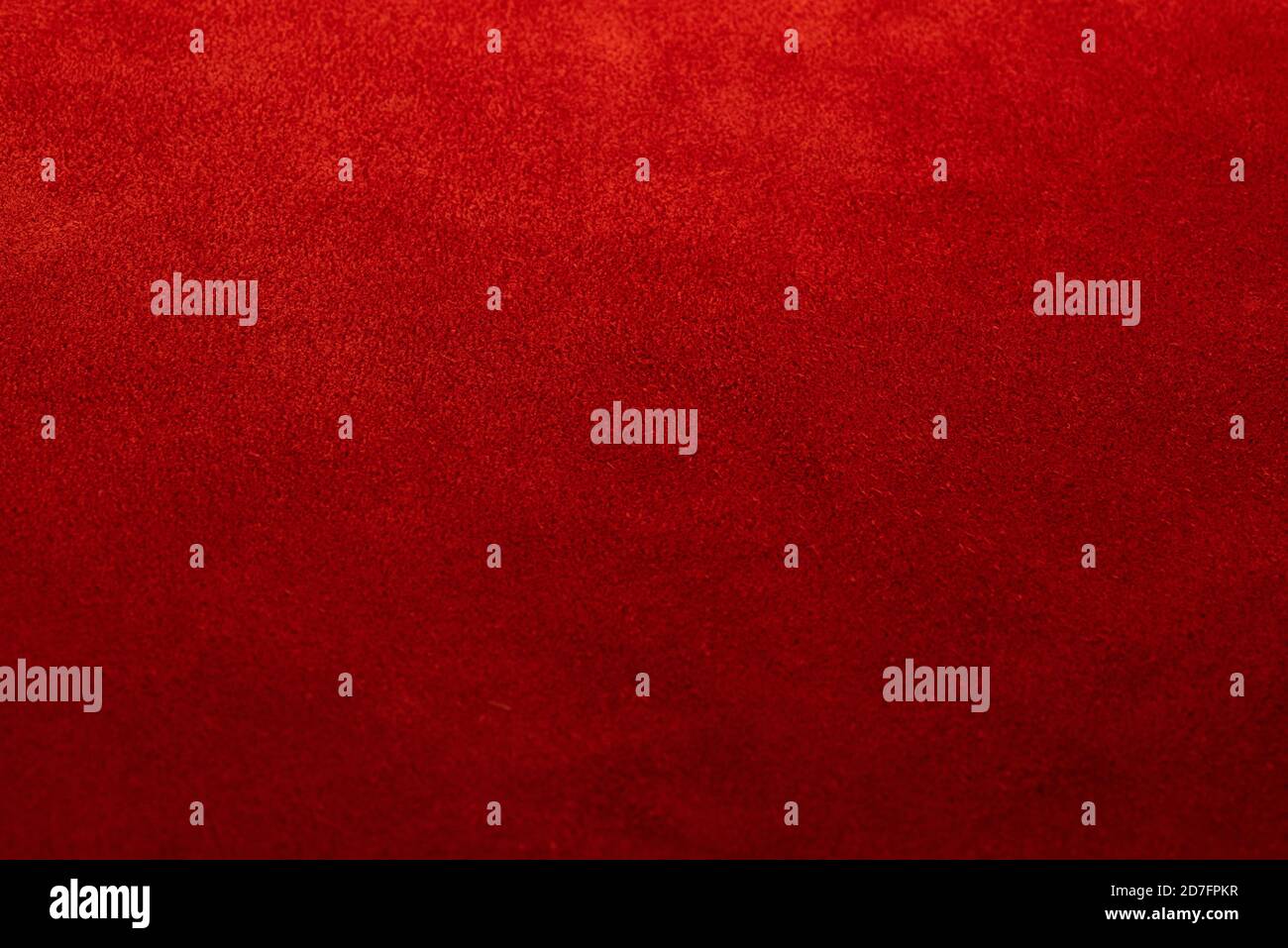 Red matte background of suede fabric, closeup. Velvet texture of ...