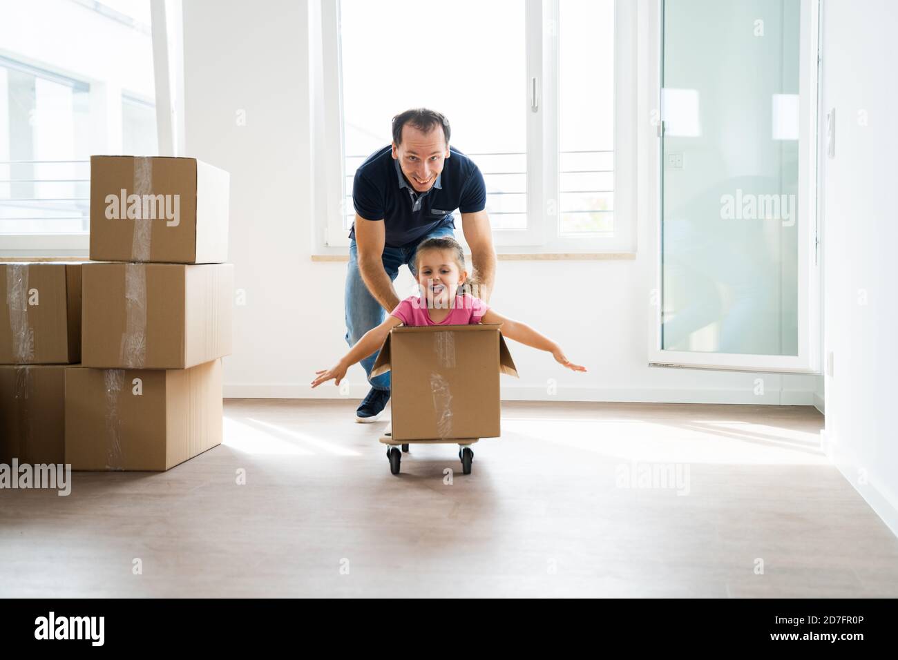 Happy People Moving Into New House Or Home Stock Photo - Alamy