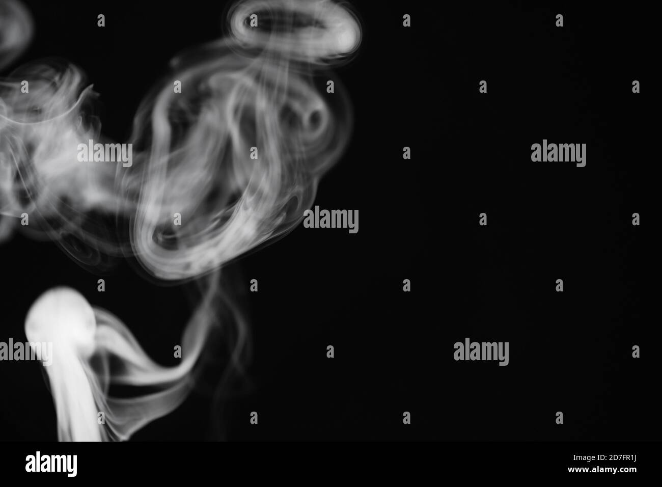 White smoke on a black background. Texture of smoke. Clubs of white ...