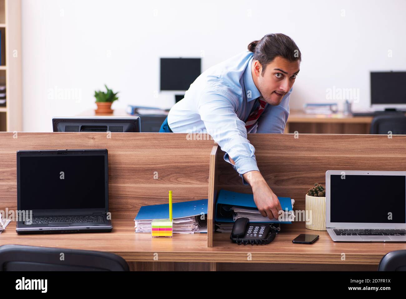 Male employee in industrial espionage concept Stock Photo - Alamy