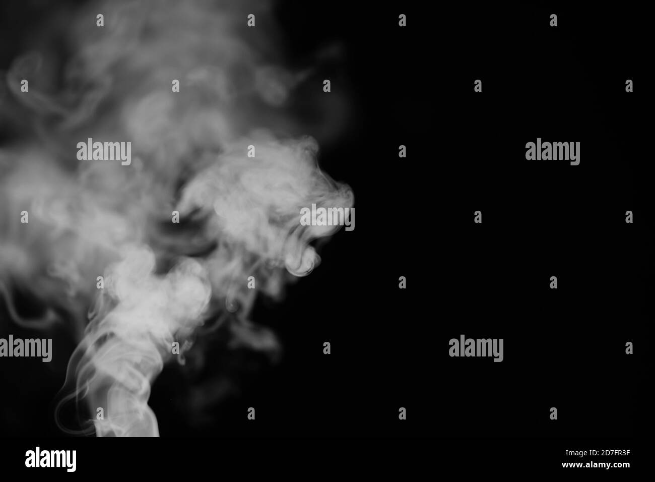 White smoke on a black background. Texture of smoke. Clubs of white ...