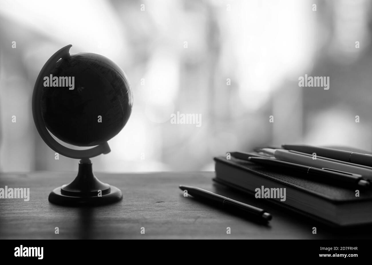 Clock on blue background Black and White Stock Photos & Images - Alamy