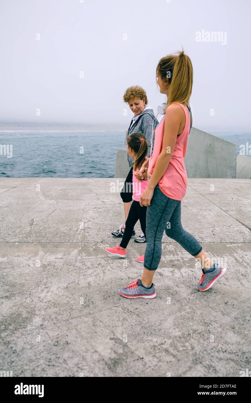 Three female generations walking Stock Photo - Alamy