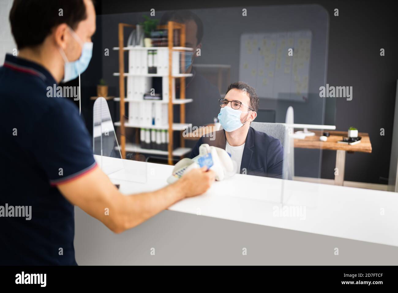 Hotel Reception Desk Counter With Face Mask Stock Photo - Alamy