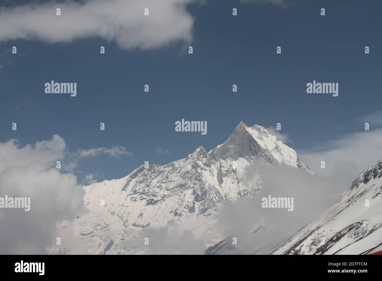 Majestic shot of a snow-covered rocky Annapurna massif with peaks in ...
