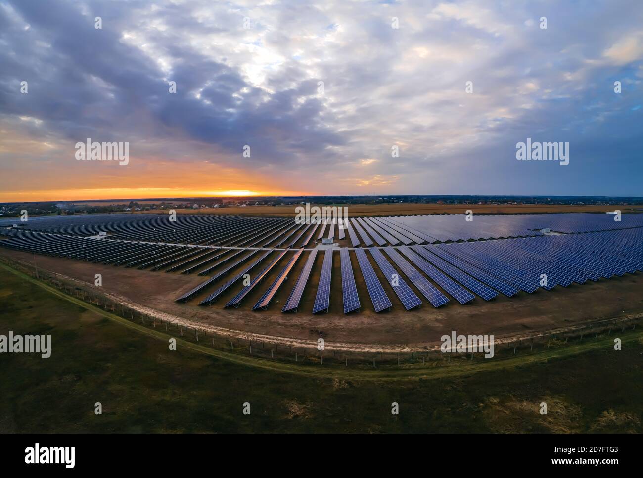 Aerial panorama view of large solar panels at a solar farm at bright ...
