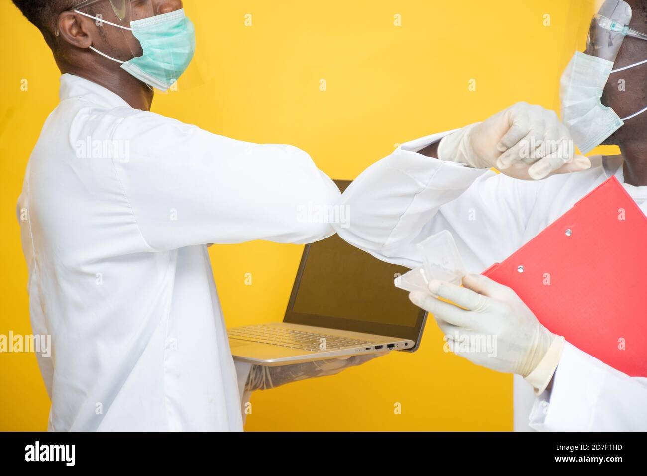 two african lab scientists greet by touching their elbows Stock Photo ...