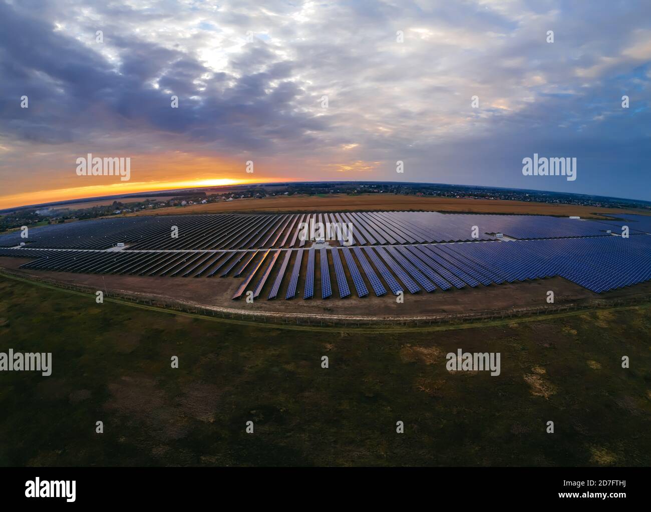 Aerial panorama view of large solar panels at a solar farm at bright ...