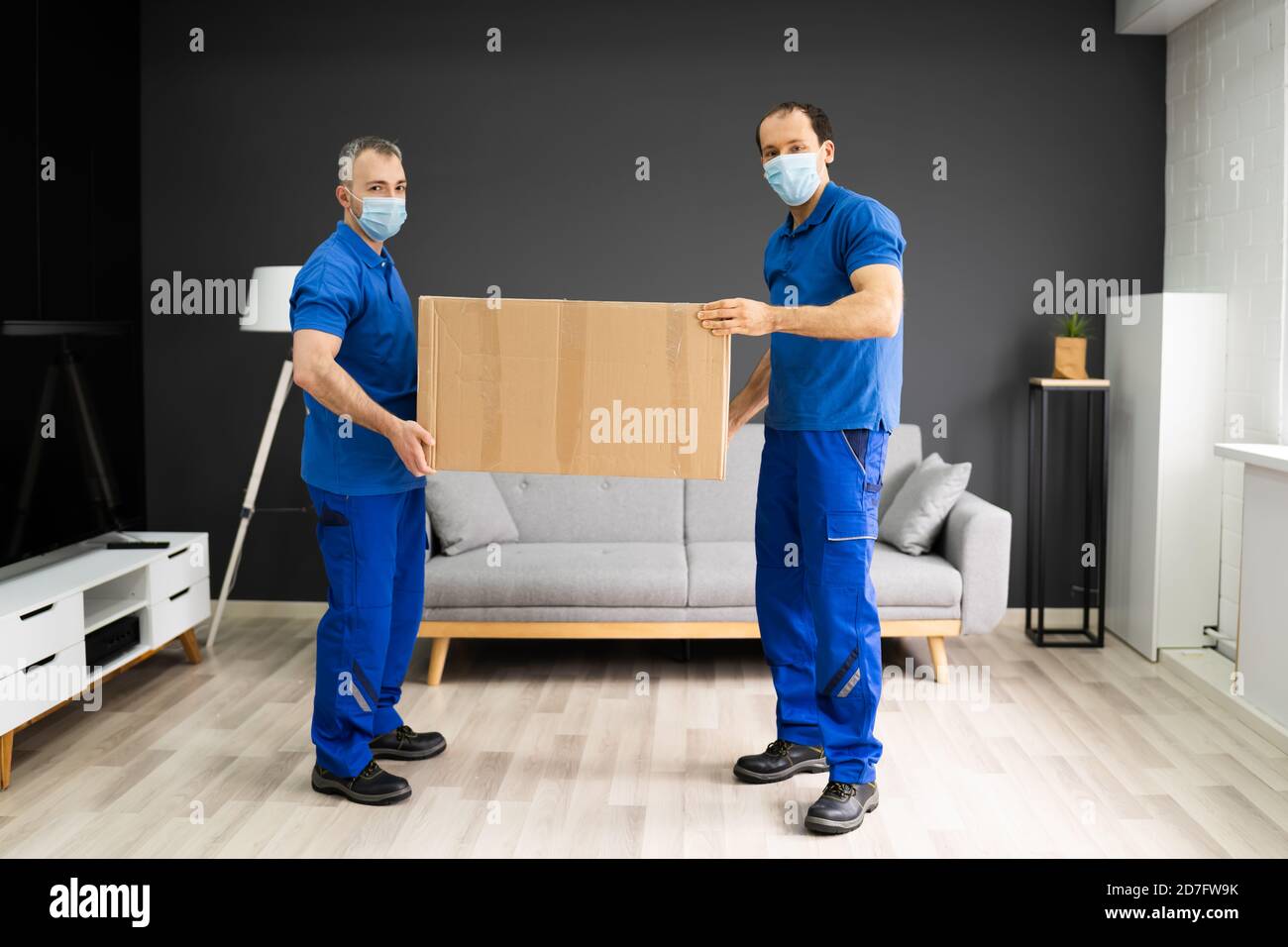 Movers Services. House Move In Face Mask Stock Photo - Alamy
