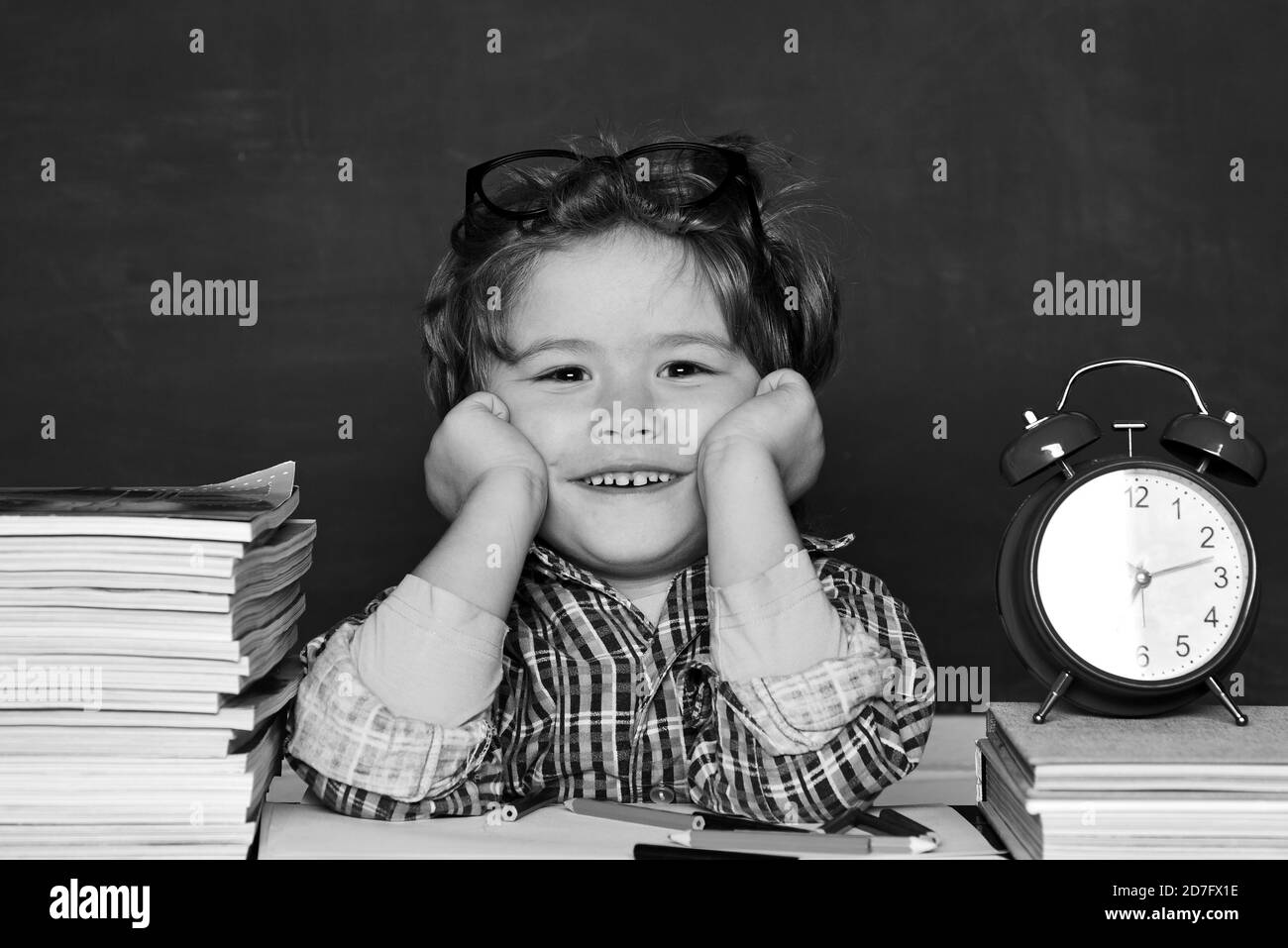 September 1. Blackboard copy space. Back to school. Funny little boy ...