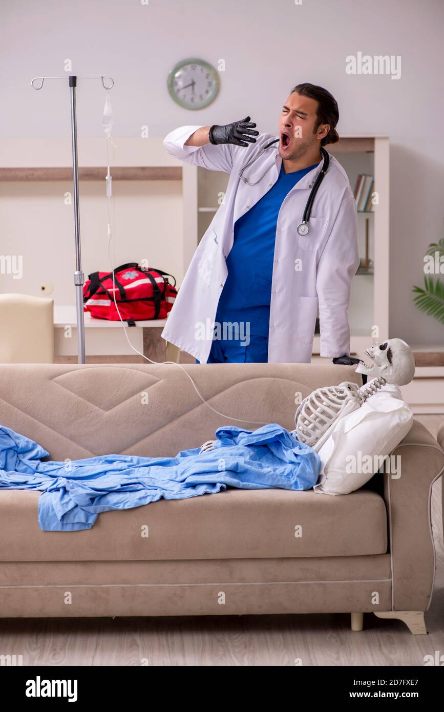 Male paramedic visiting skeleton patient Stock Photo - Alamy