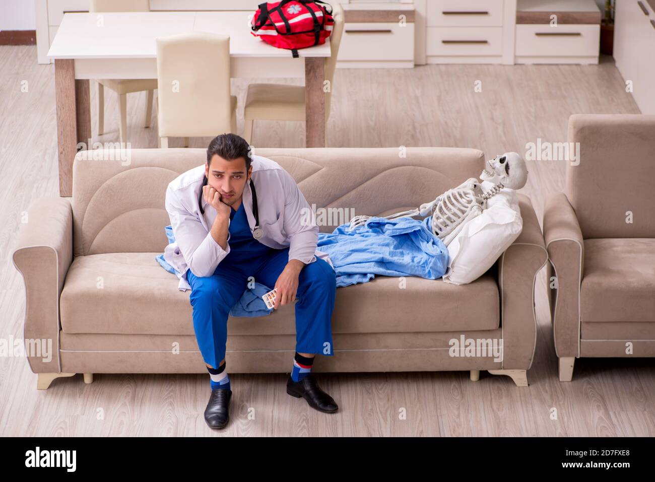 Male paramedic visiting skeleton patient Stock Photo - Alamy