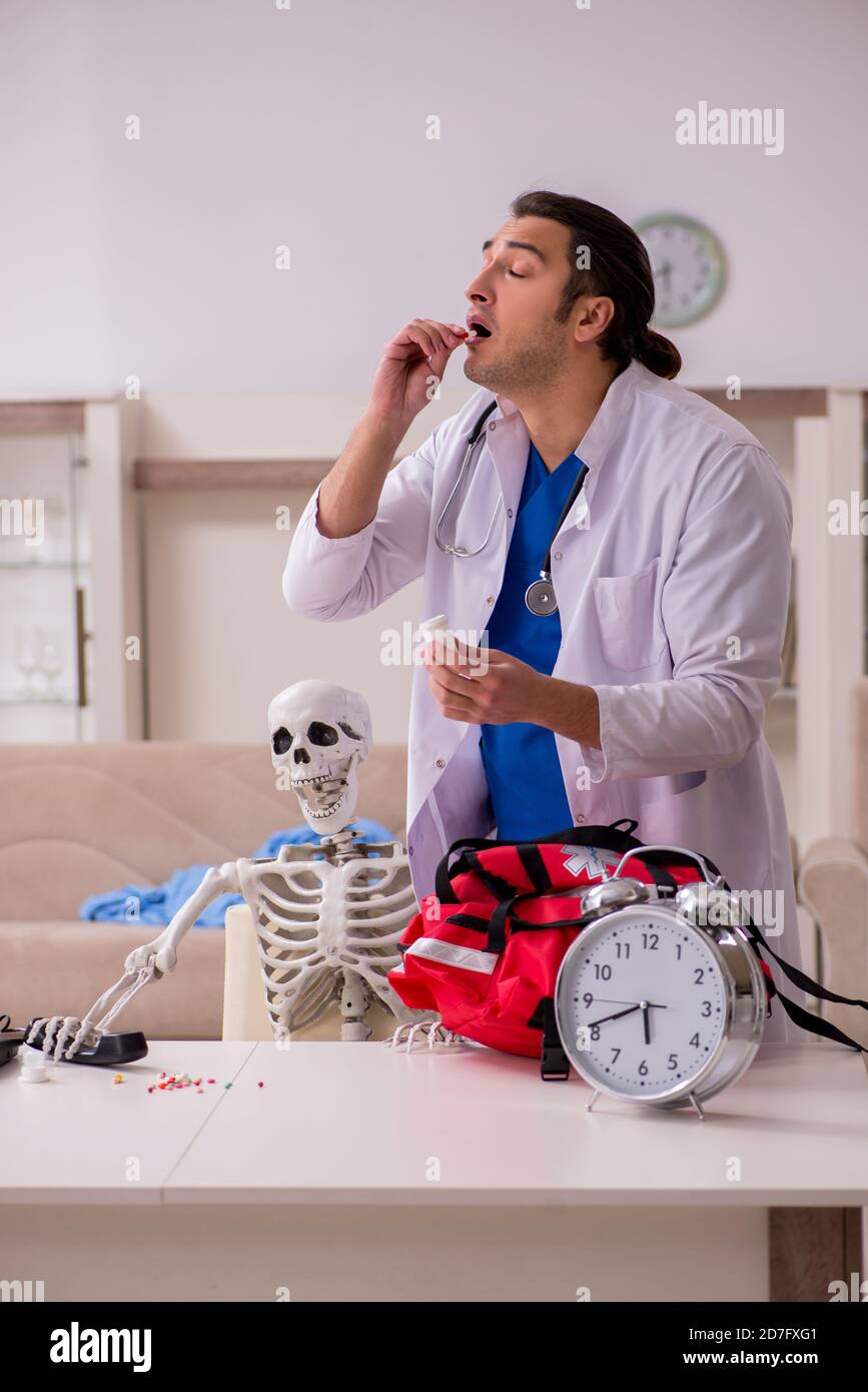 Male paramedic visiting skeleton patient Stock Photo - Alamy