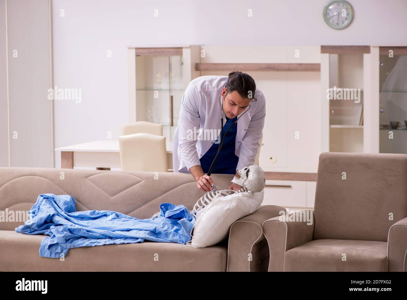 Male paramedic visiting skeleton patient Stock Photo - Alamy