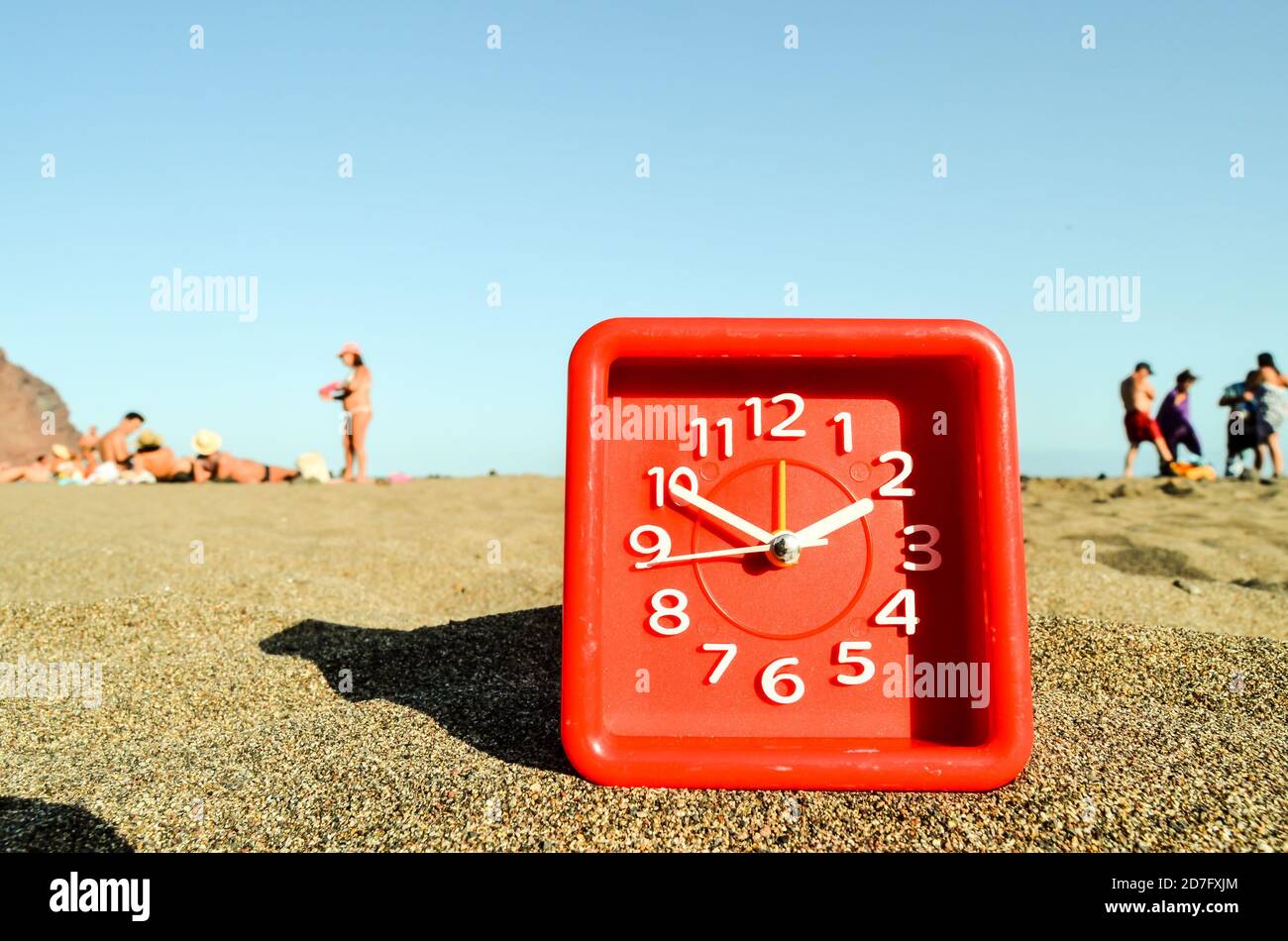 Clock on the Sand Beach Stock Photo - Alamy