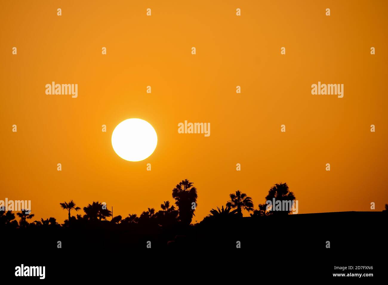The Sun Setting in the Sea Stock Photo - Alamy