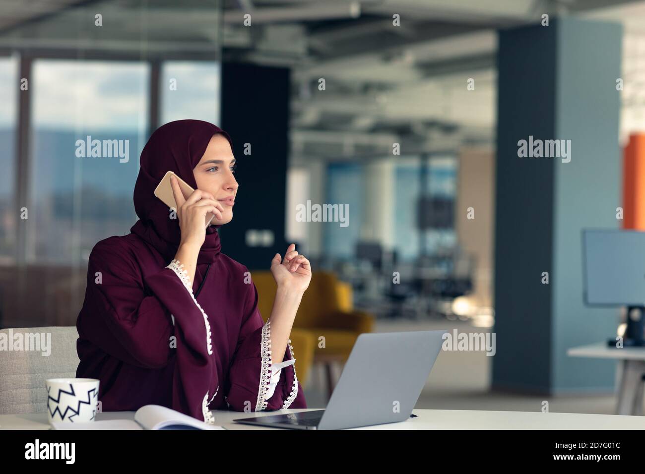 Happy muslim businesswoman in hijab at office workplace. Smiling Arabic ...