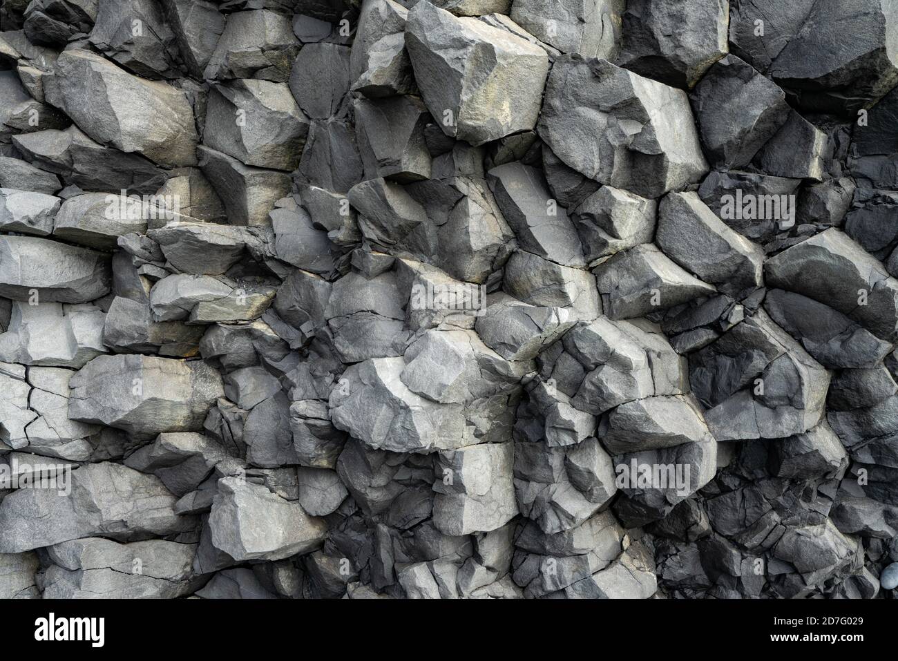 Backdrop from basalt volcanic rock formations in Reinisfjara beach near ...
