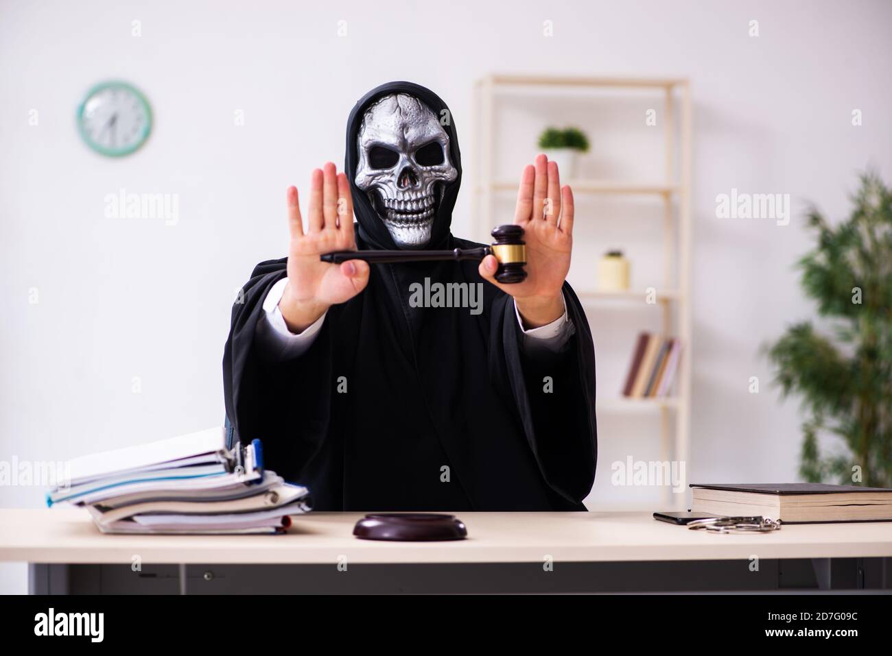 Devil judge working in the courthouse Stock Photo - Alamy