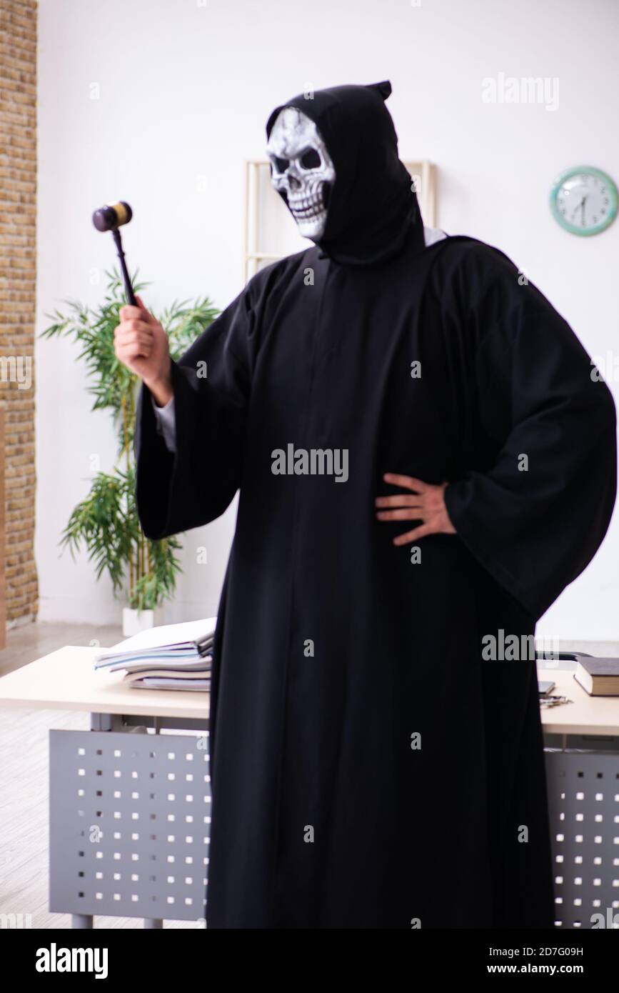 Devil judge working in the courthouse Stock Photo - Alamy