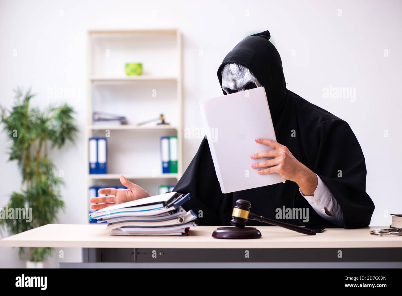 Devil judge working in the courthouse Stock Photo - Alamy