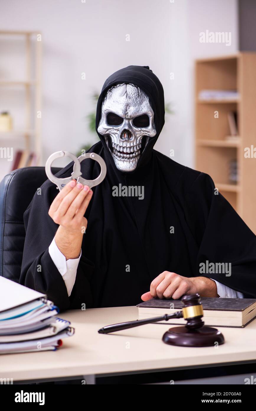 Devil judge working in the courthouse Stock Photo - Alamy