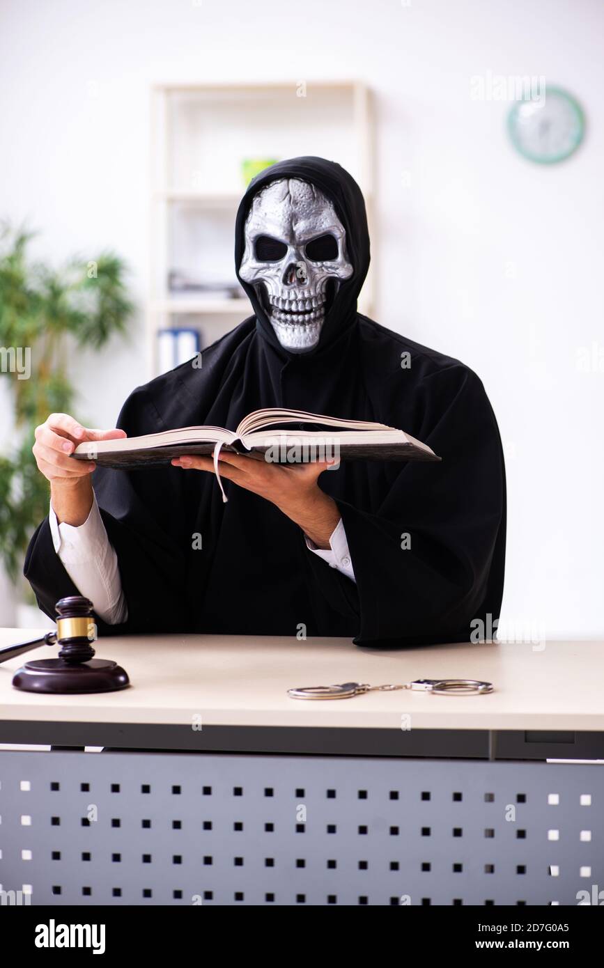 Devil judge working in the courthouse Stock Photo - Alamy