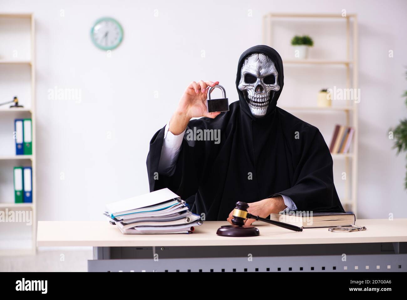 Devil judge working in the courthouse Stock Photo - Alamy
