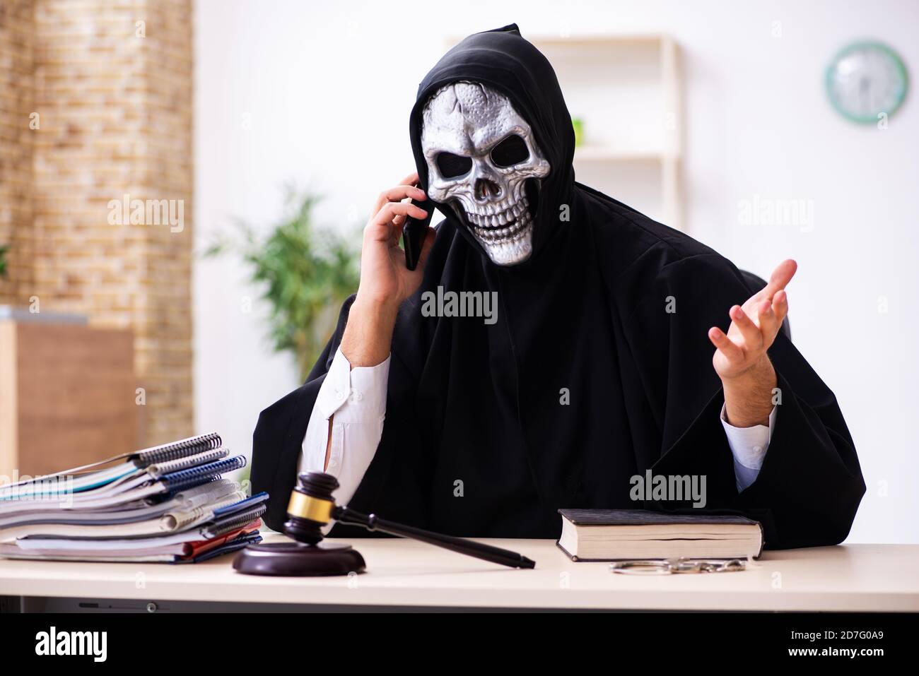 Devil judge working in the courthouse Stock Photo - Alamy