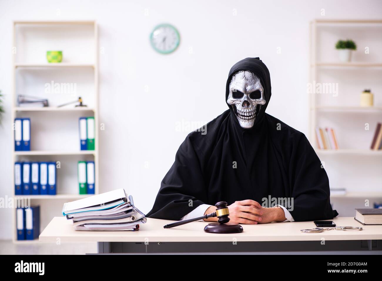 Devil judge working in the courthouse Stock Photo - Alamy