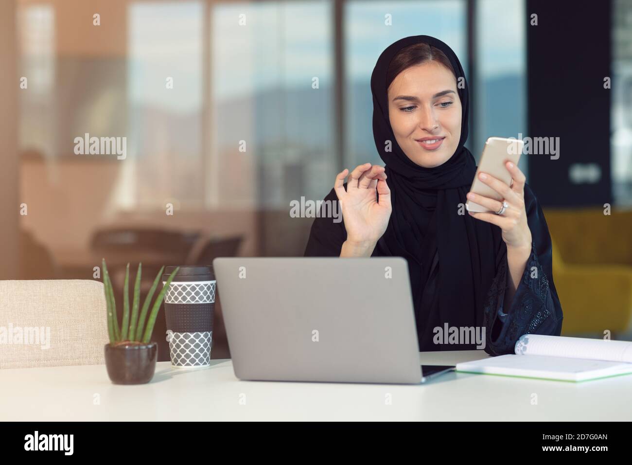 Happy muslim businesswoman in hijab at office workplace. Smiling Arabic ...