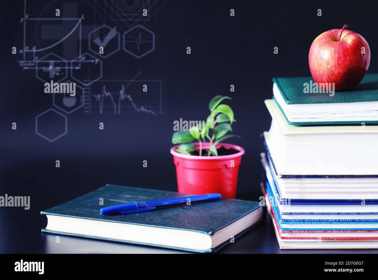 A stack of textbooks and books on table. The concept of knowledge and ...